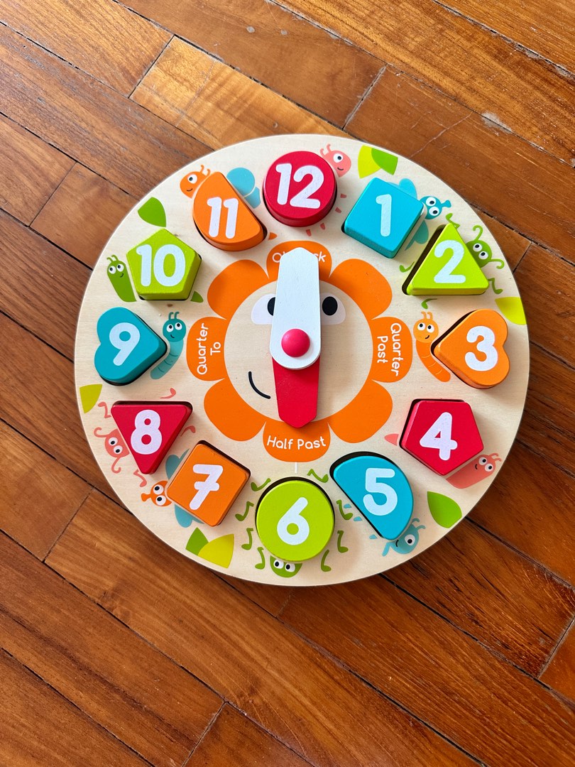 Hape Educational clock toy, Babies & Kids, Infant Playtime on Carousell