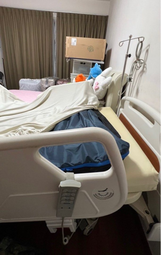 Hospital bed with railings with many functions and drip hangers ...