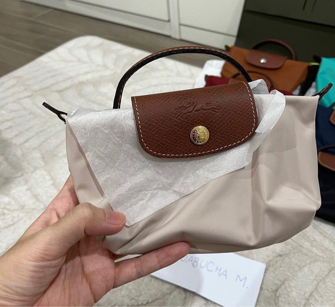 Longchamp le pliage mini pouch with handle and sling on Carousell