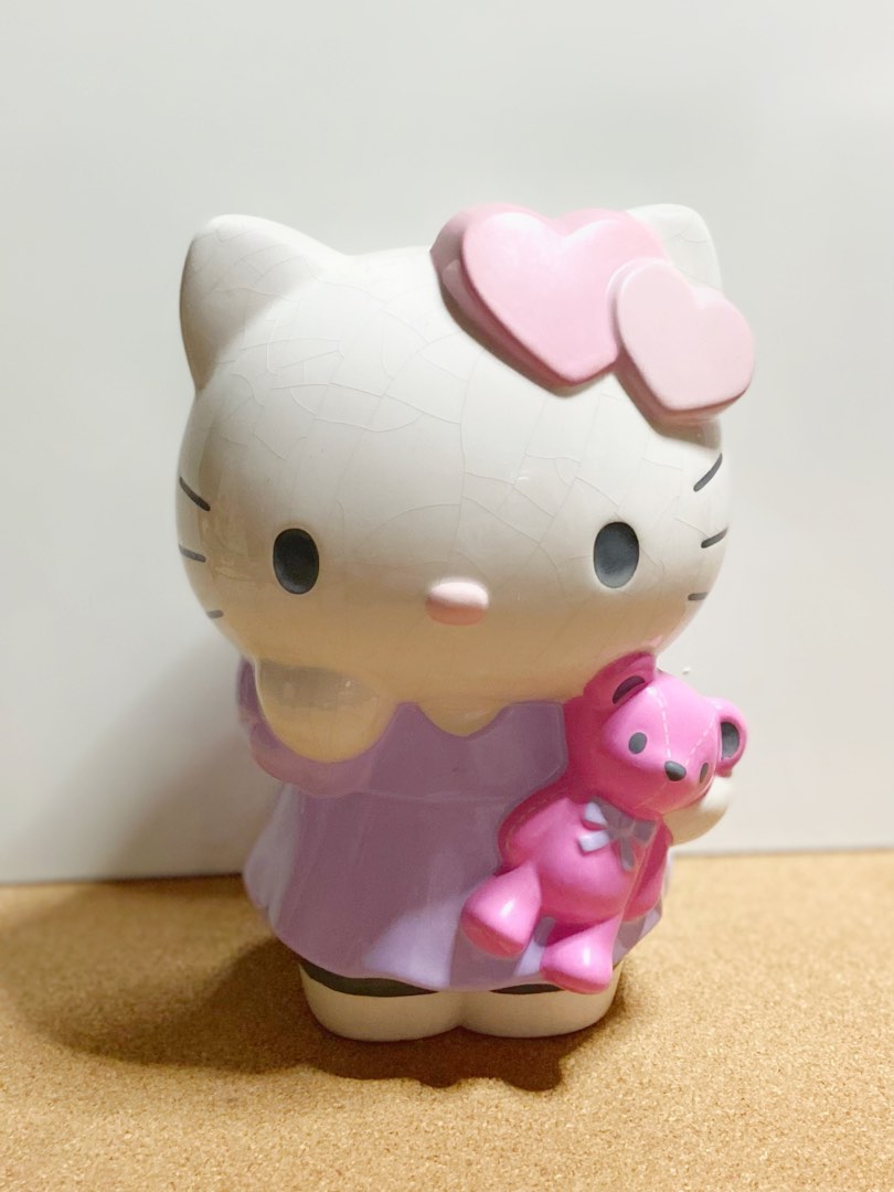 Hello kitty with teddy coin bank with crazing on Carousell