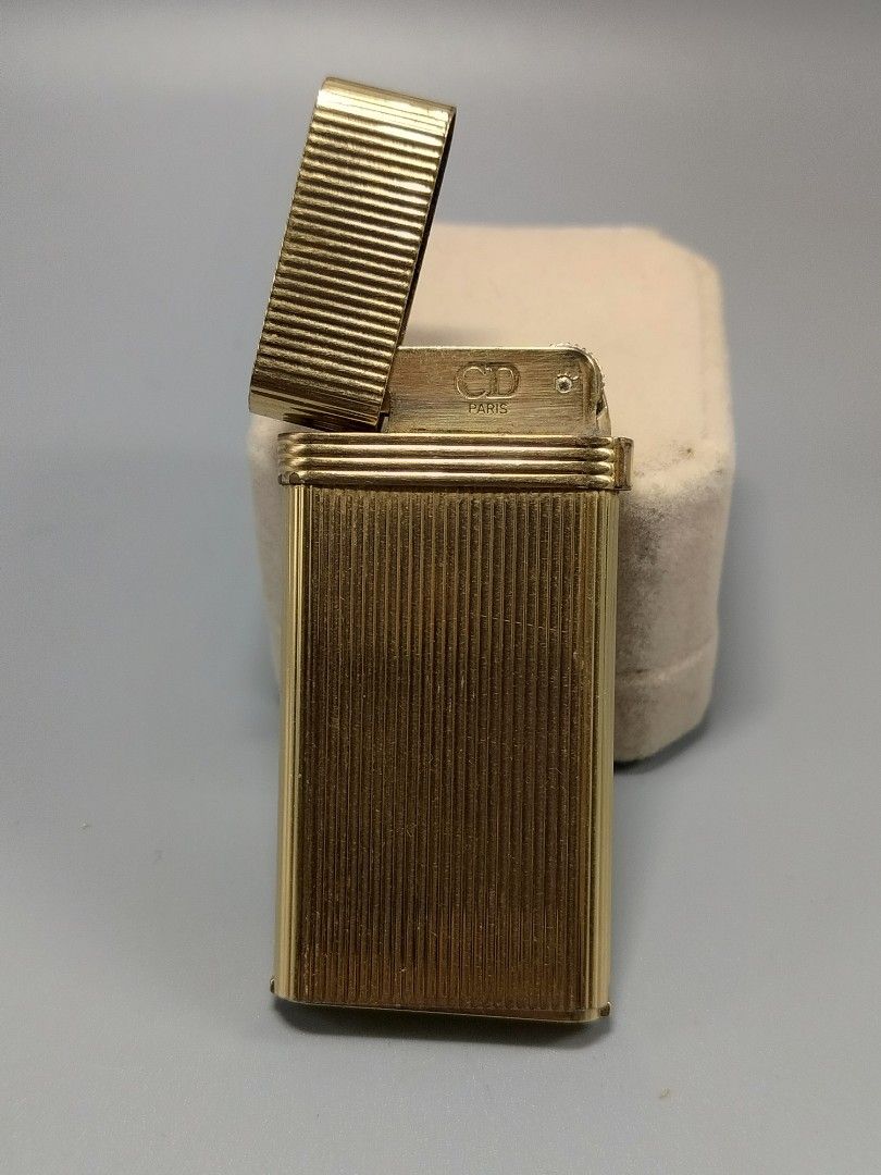 CHRISTIAN DIOR GOLD LIGHTER on Carousell