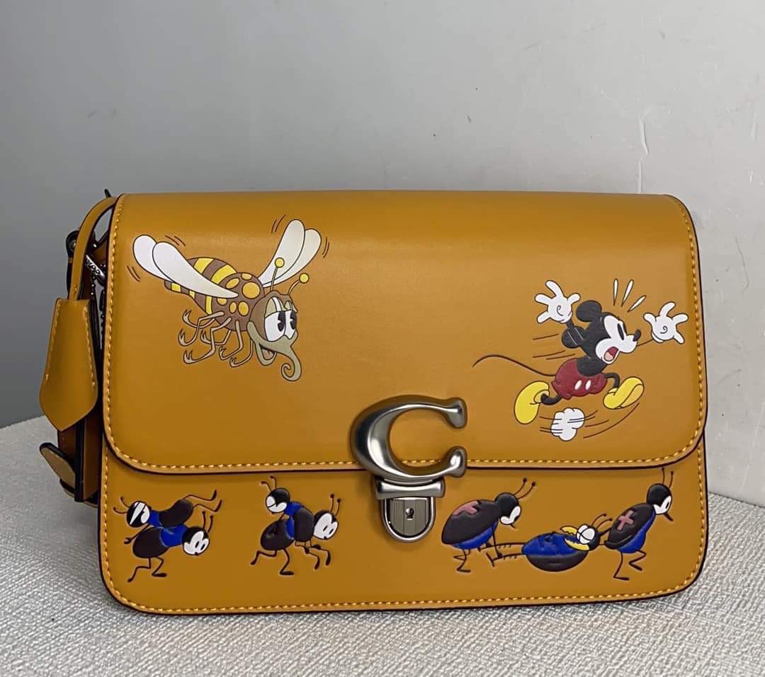 DISNEY X COACH STUDIO SHOULDER BAG WITH MICKEY MOUSE AND BUGS on Carousell
