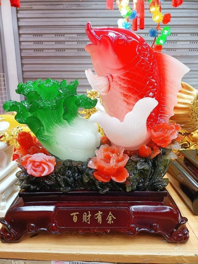 Red arowana fish hold pechay Fengshui display on Carousell