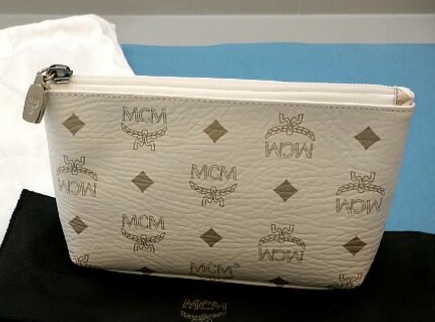 Mcm white pouch, Luxury, Bags & Wallets on Carousell