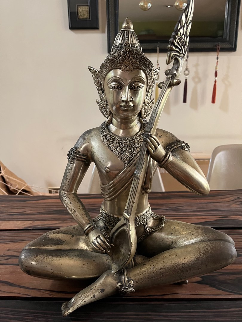 silver thai statue on Carousell