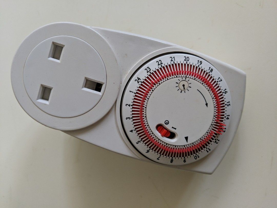Mains power outlet timer. Working white color with on/off and automatic ...