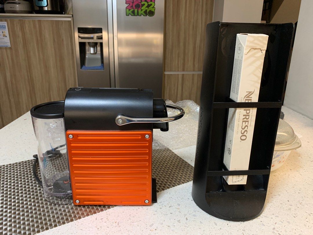 Nespresso Pixie Machine with FREE capsule dispenser) on Carousell
