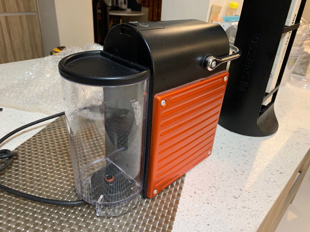 Nespresso Pixie Machine with FREE capsule dispenser) on Carousell