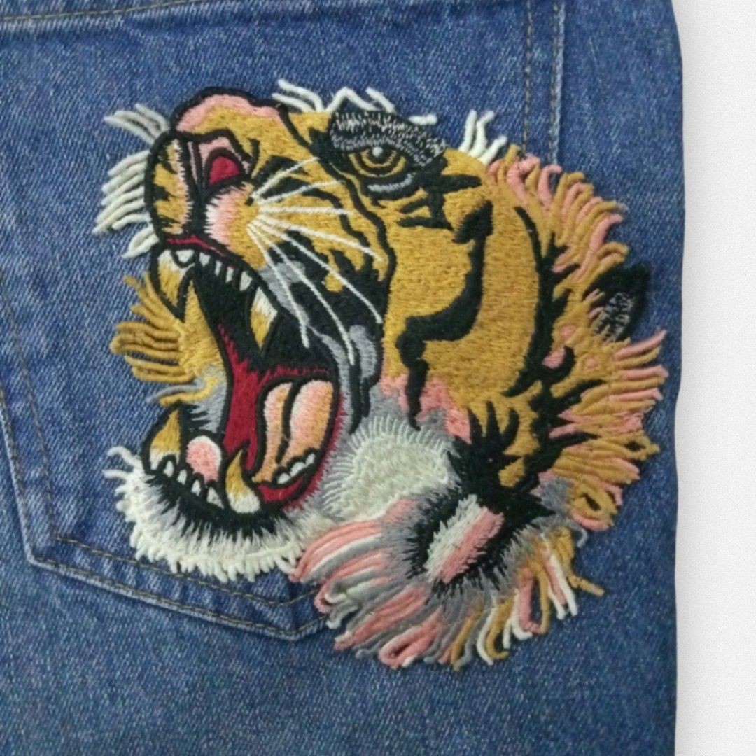 GUCCI original embroidered tiger jeans in blue on Carousell