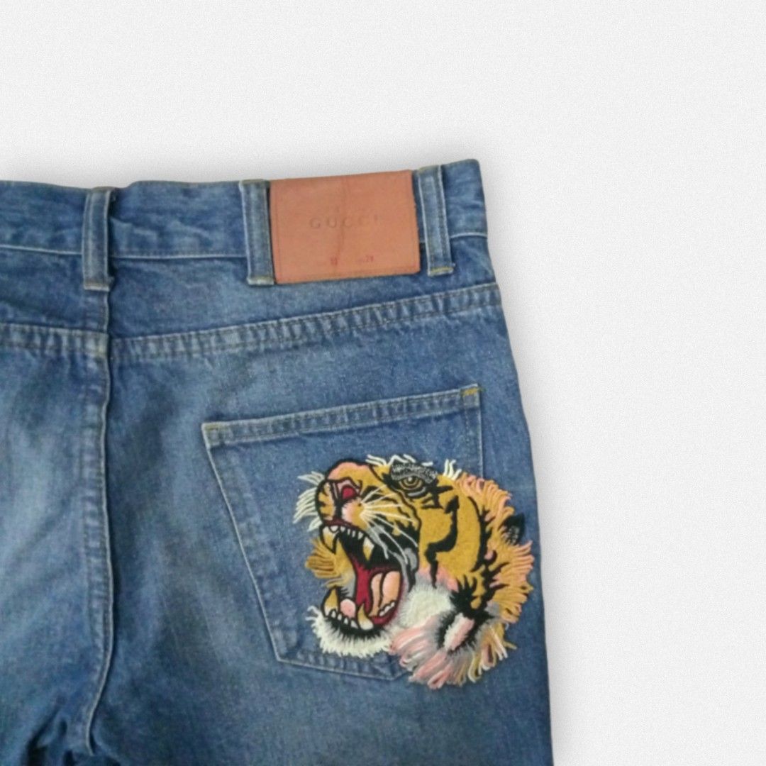 GUCCI original embroidered tiger jeans in blue on Carousell