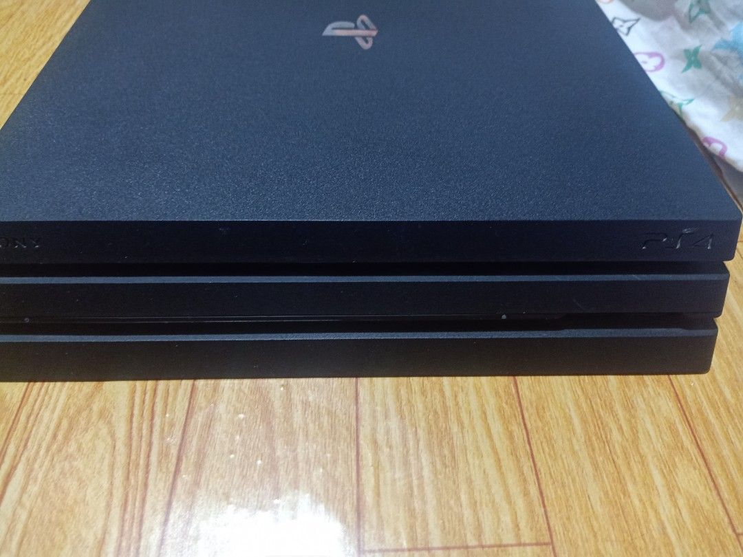 PS4 PRO WITHOUT BOX AND CONTROLLER WITH 2 DISC GAMES on Carousell