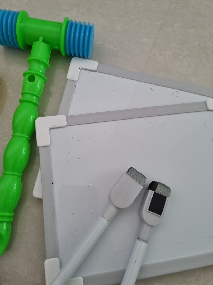 Finger pointing stick, toy hammer and small white board for games ...