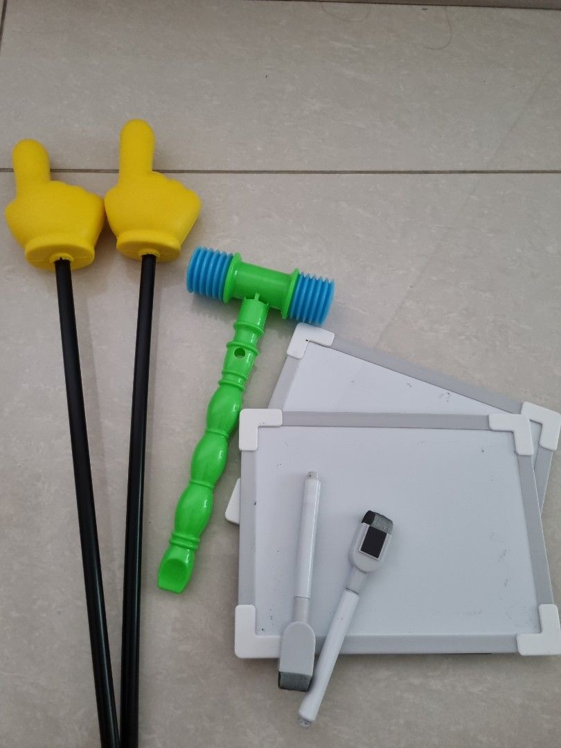 Finger pointing stick, toy hammer and small white board for games ...