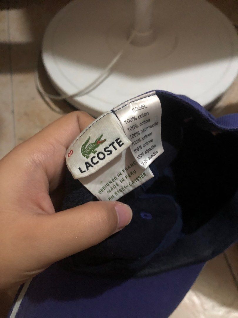 Lacoste purple cap on Carousell