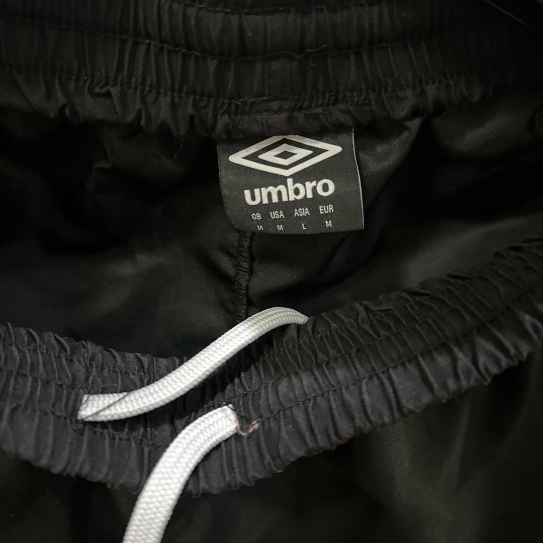 Vintage Umbro shorts with side print on Carousell