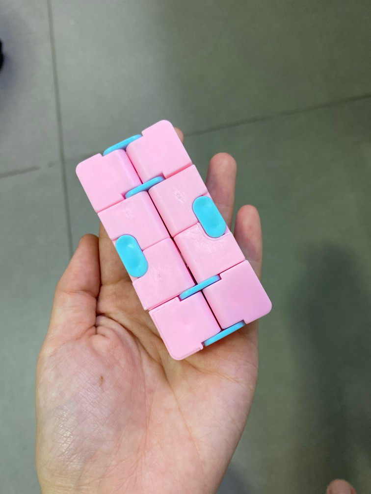 Pink and blue fidget toy, Hobbies & Toys, Toys & Games on Carousell