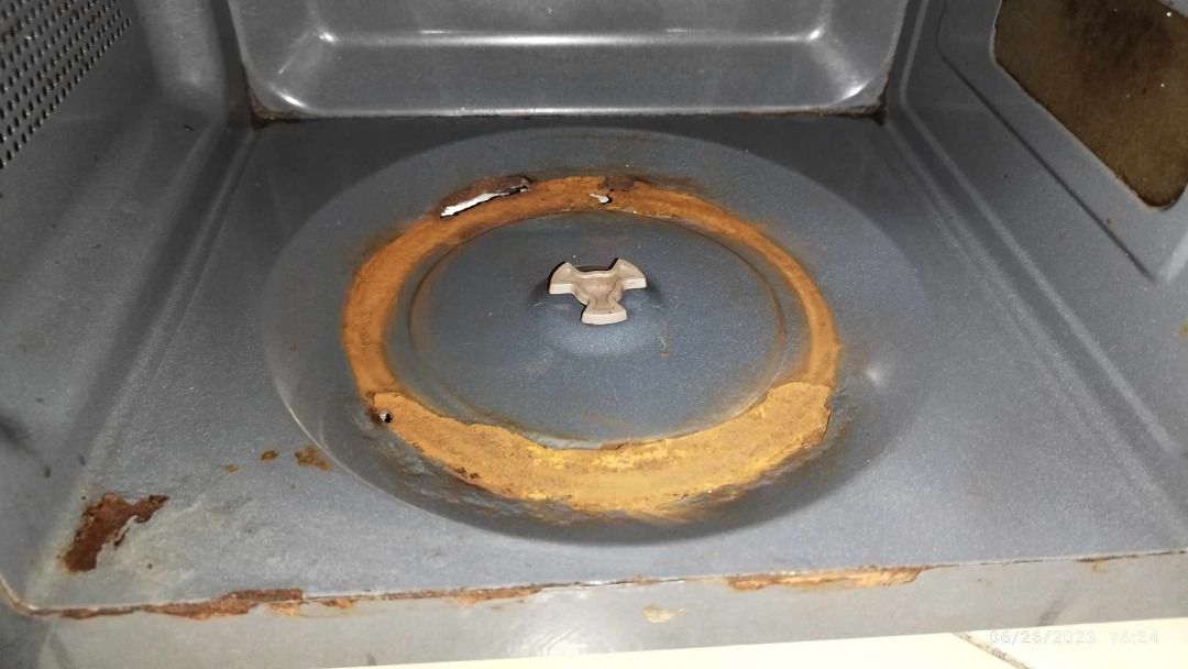 Microwave with rusted bottom on Carousell