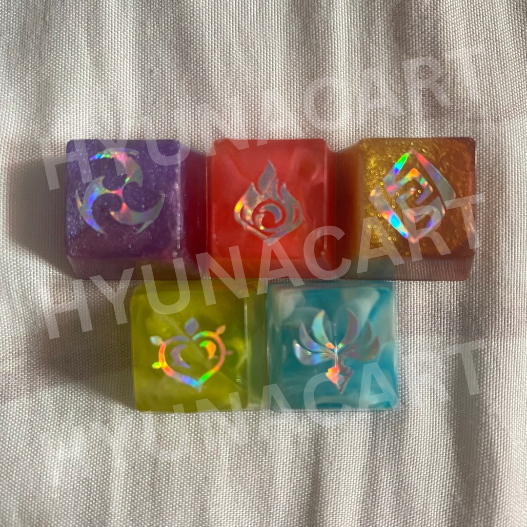 genshin impact keycaps (electro, pyro, anemo, & geo) on Carousell