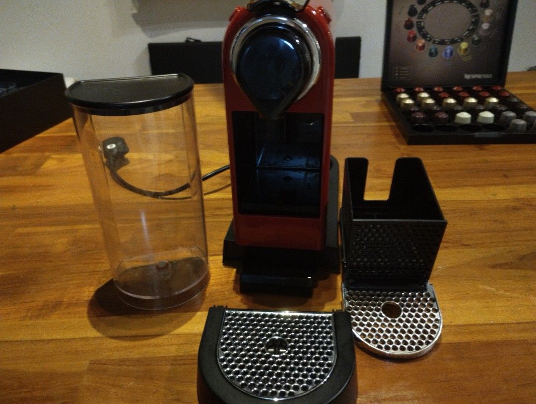 Nespresso coffee machine + View set and box with some capsules, TV ...