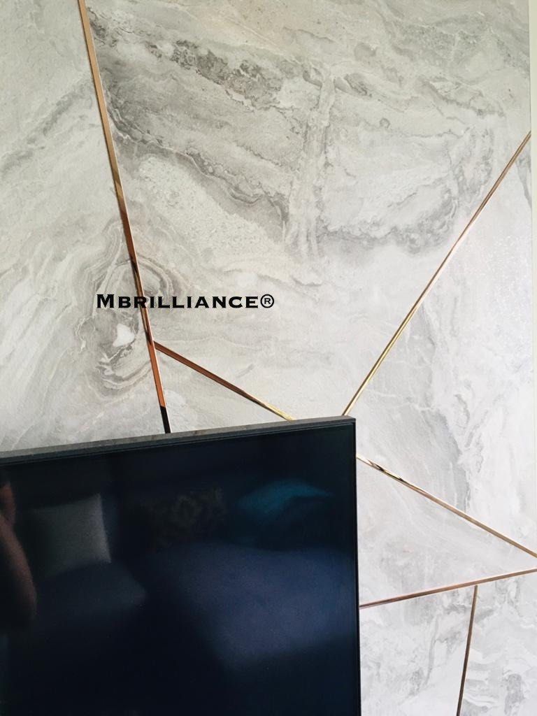 Fluted panel feature wall tv console with stainless steel lining strips ...