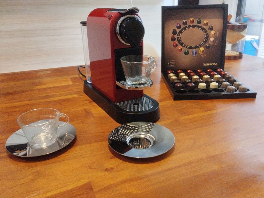Nespresso coffee machine + View set and box with some capsules, TV ...