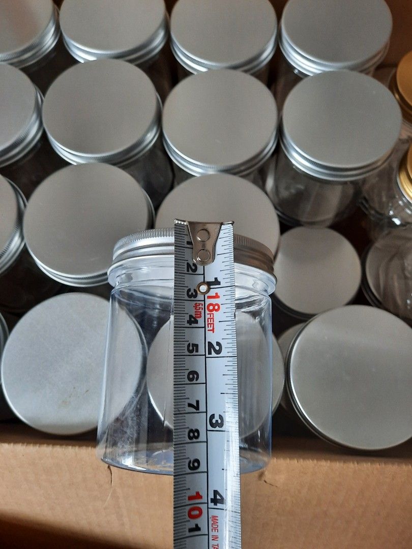 Clear plastic rectangular containers and plastic and metal cylindrical ...