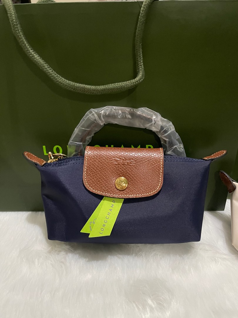 Longchamp mini pouch with strap on Carousell
