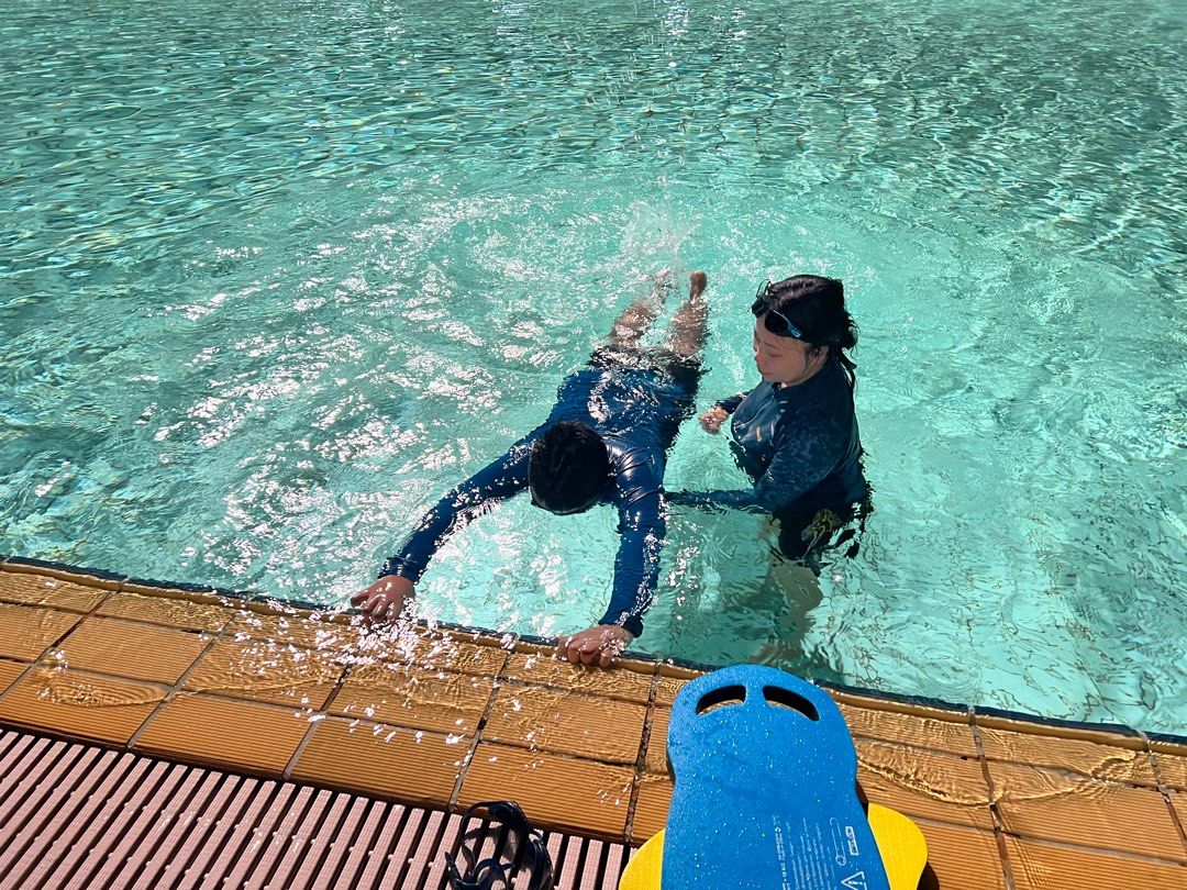 Swimming lessons by female swim teacher, island wide, few footsteps ...