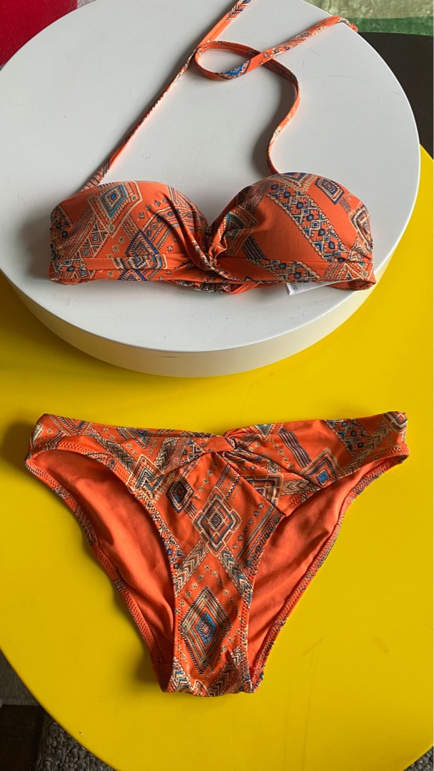 Two piece orange bikini swimsuit on Carousell
