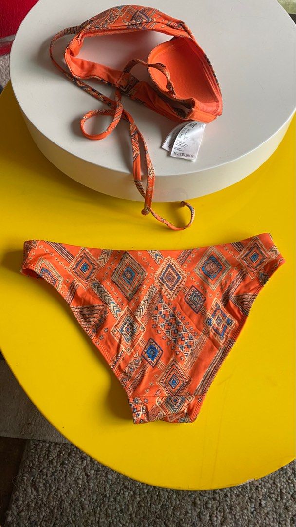 Two piece orange bikini swimsuit on Carousell