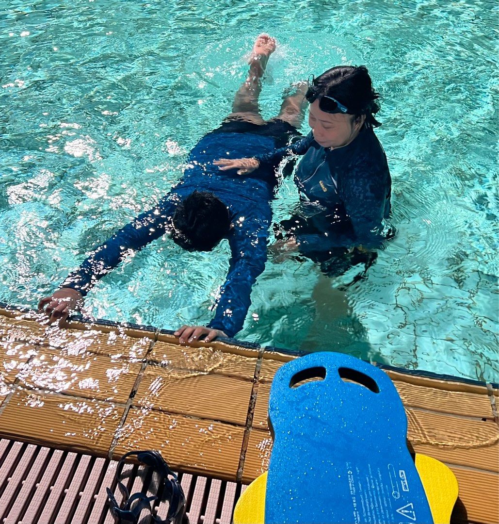 Swimming lessons by female swim teacher, island wide, few footsteps ...