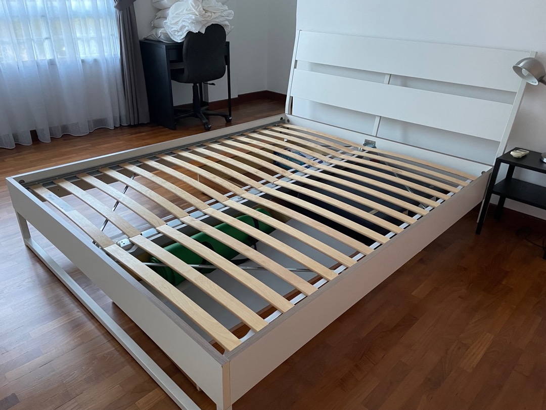 IKEA Wooden frame Queen bed frame with wood slatted. 2 roll-out storage drawers included ...