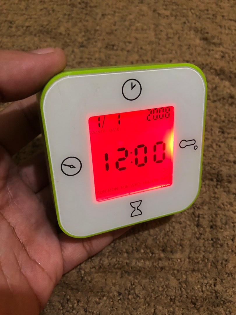 Multi function rotating desk clock-alarm-temp-stopwatch on Carousell