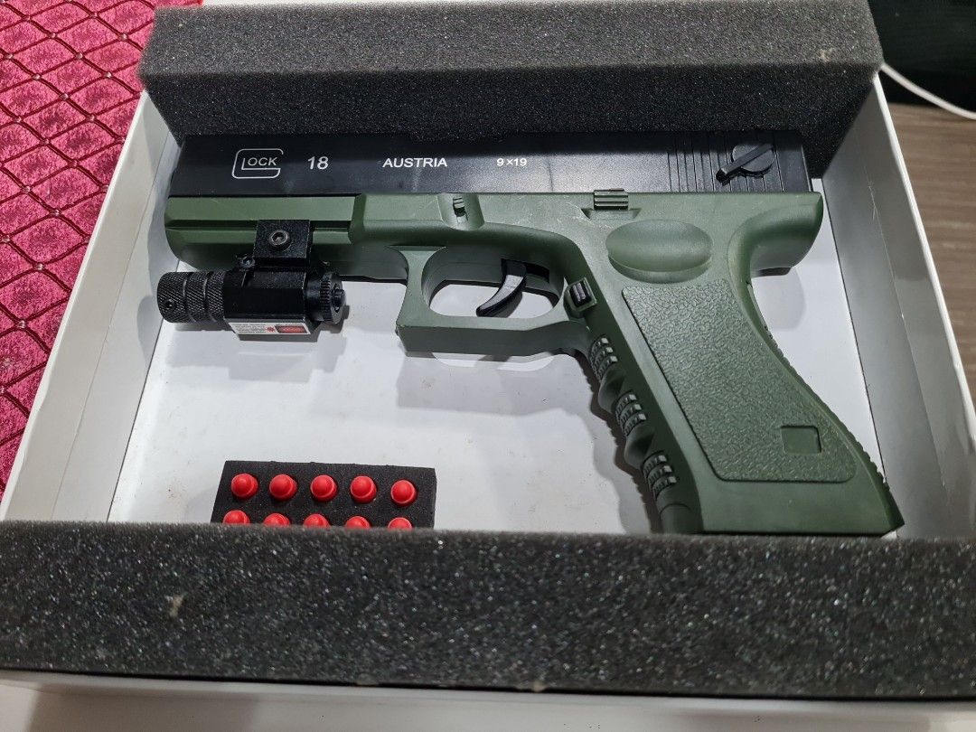 Shell Ejecting Glock with Laser, Hobbies & Toys, Toys & Games on Carousell