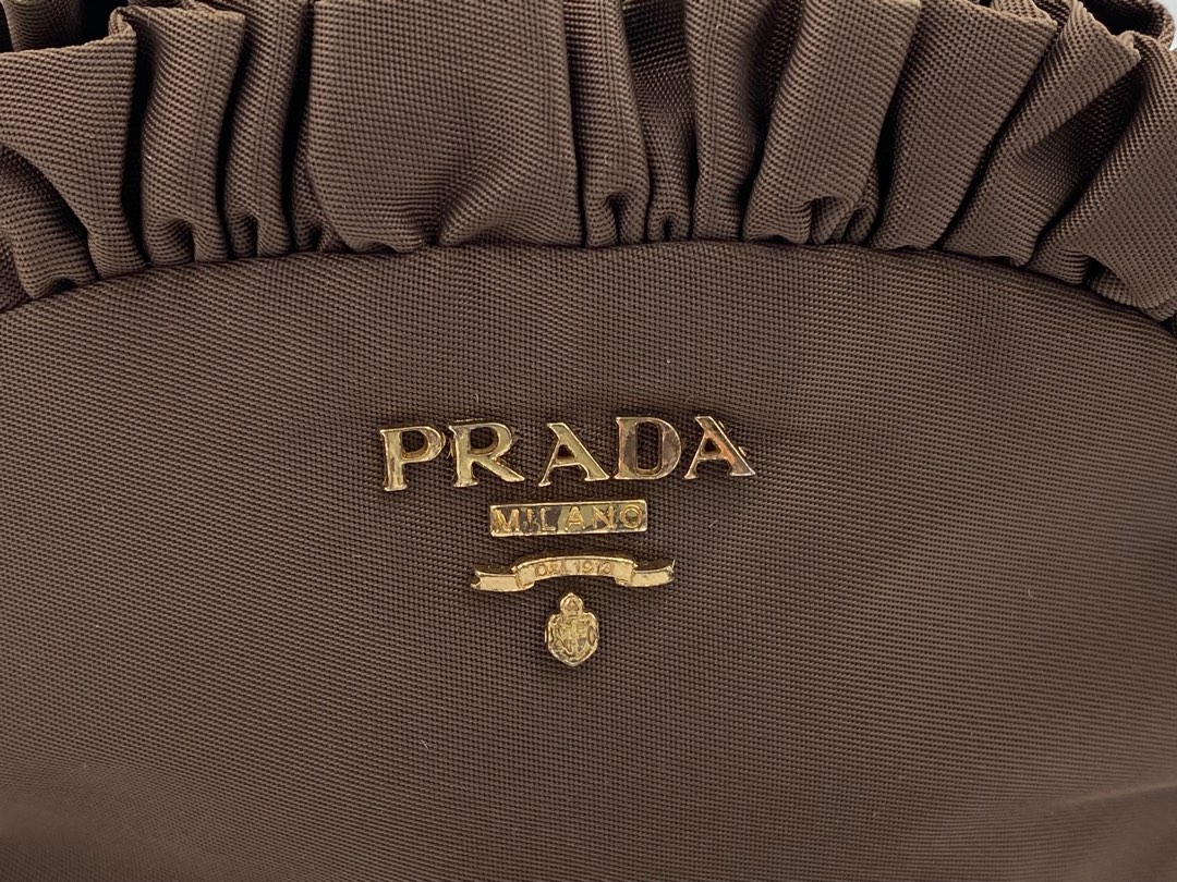 Prada ruffled brown pouch on Carousell