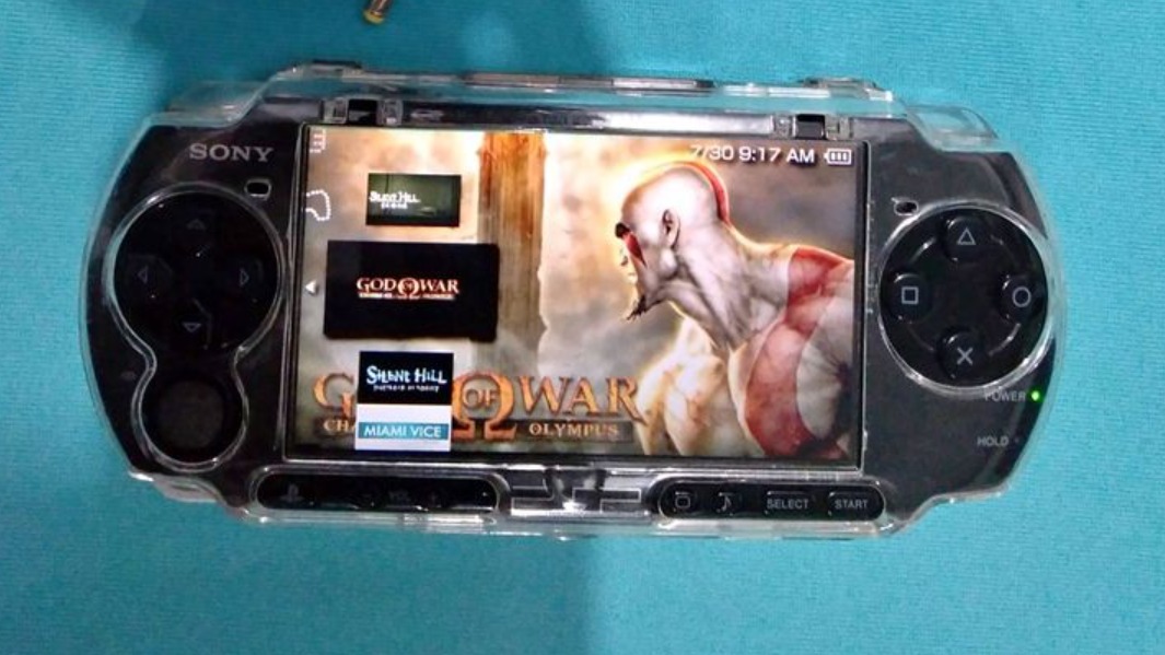 PSP (PlayStation Portable) with Protective Casing and Charger (no ...