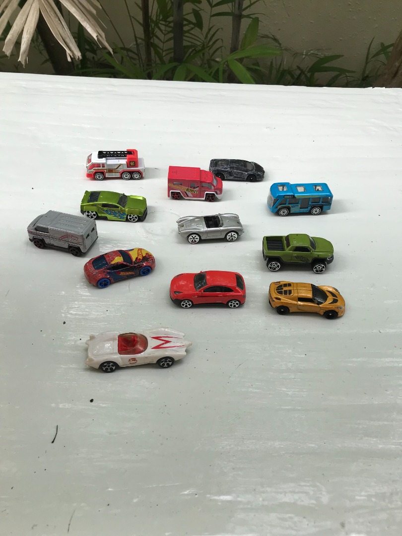 Assorted toy cars. All 12 items for $10. Brands include Tomy, Tomicar ...