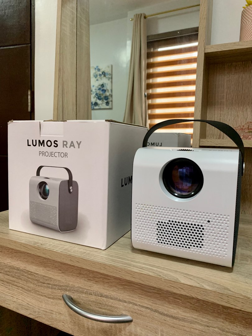 Lumos projector with free screen and tripod on Carousell