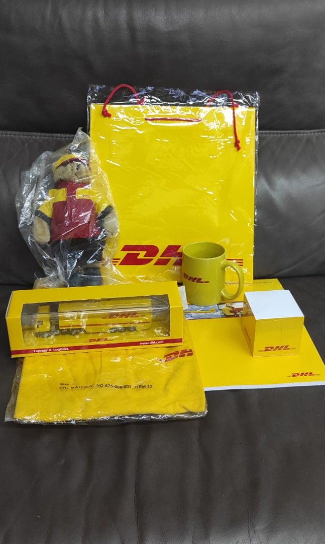 DHL Souvenir Set . 1 Truck .1 bear . 1 poloshirt . 1 Cup . 1 Memo Pad ...