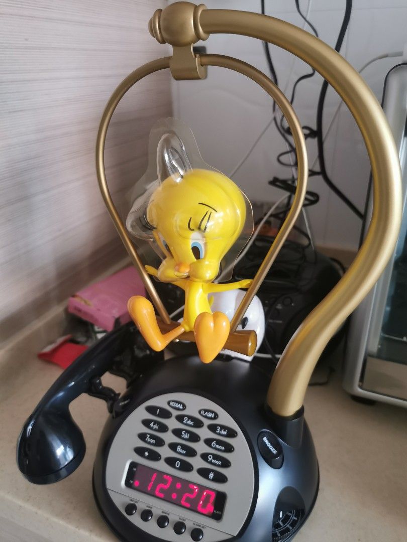 Telephone, plus radio, clock and alarm, animated tweety bird ringing ...