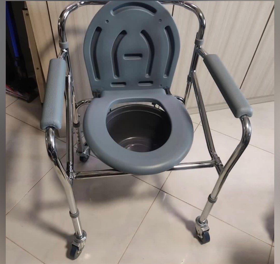 Brand New Commode with wheels comes with free portable urinal bottle ...