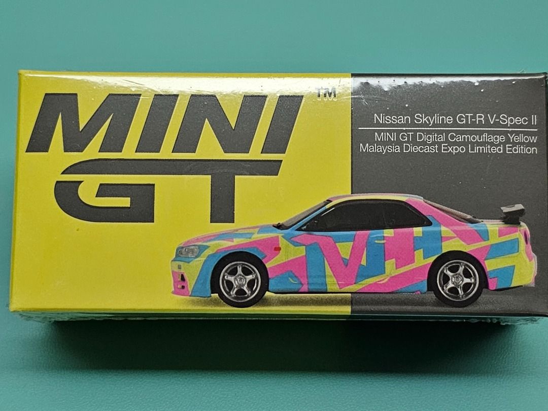 MINI GT Nissan Skyline GT-R (R34) V-Spec II Digital Camouflage Yellow ...