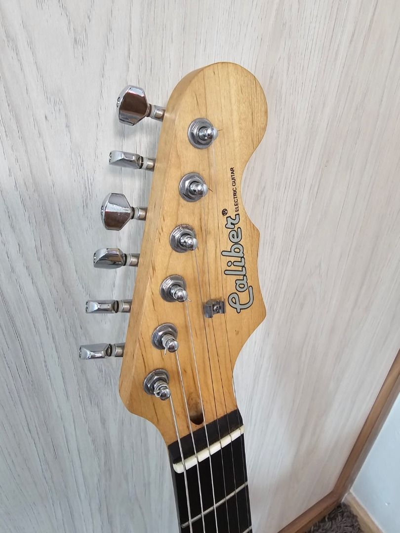 Dive into the Electric Realm with the Caliber Stratocaster Guitar - A ...