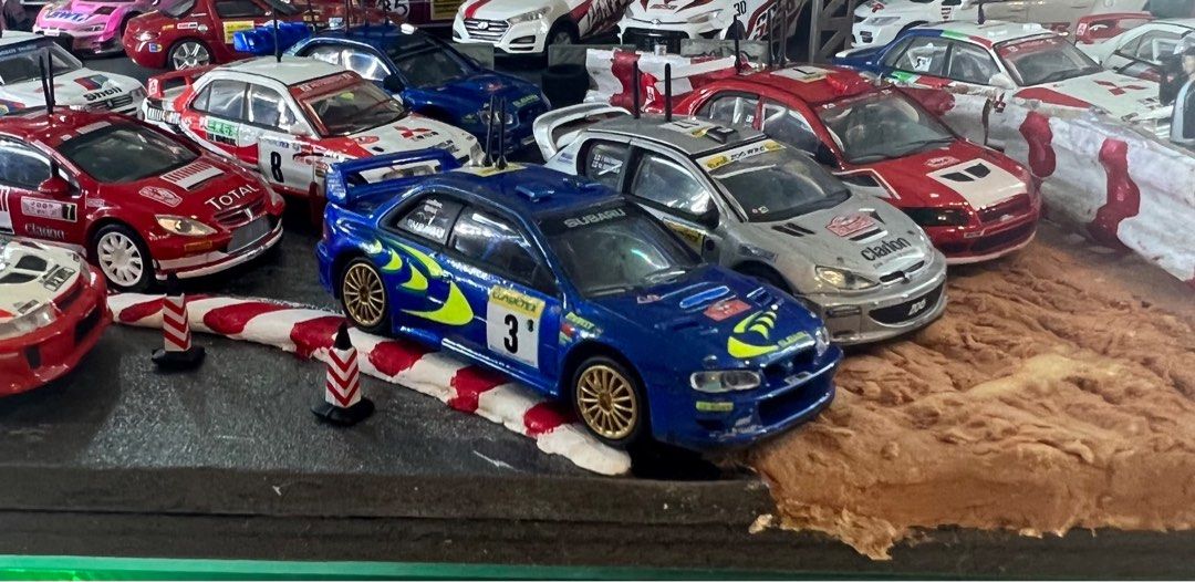 1/64 lot of 21 CMS rally cars - Mitsubishi, Subaru & Peugeot, Hobbies ...