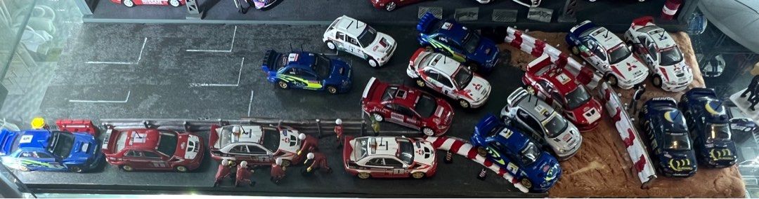 1/64 lot of 21 CMS rally cars - Mitsubishi, Subaru & Peugeot, Hobbies ...