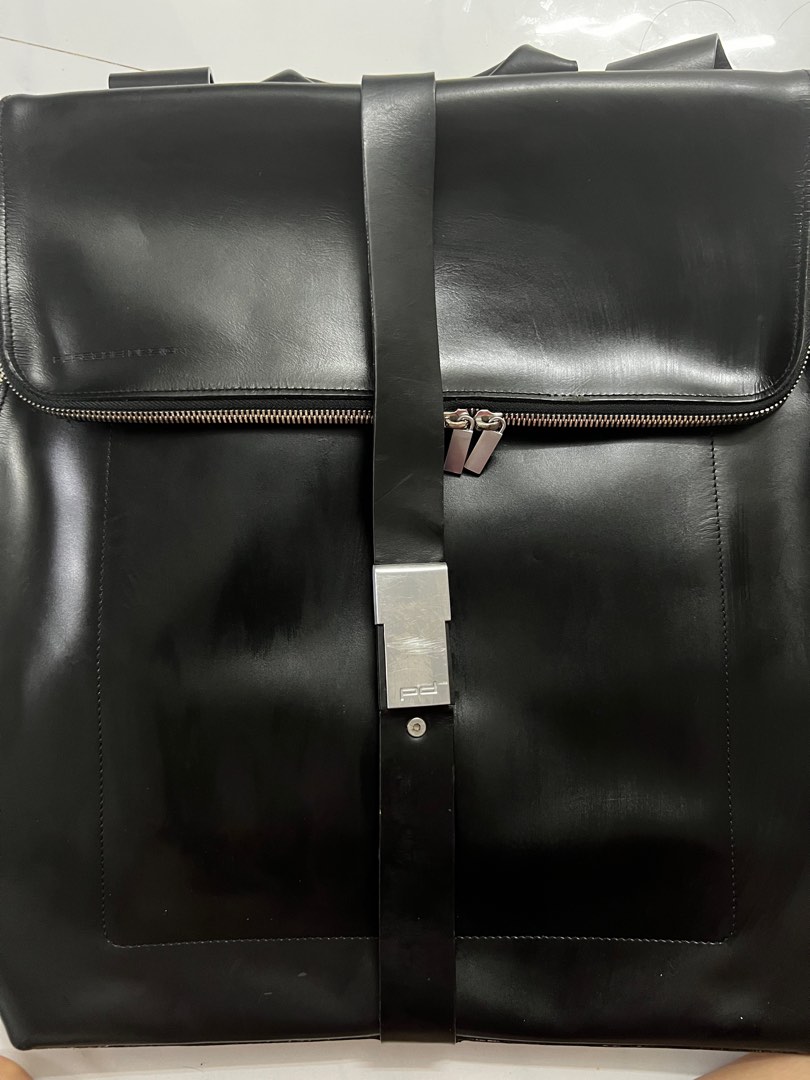 Porsche Design, Black leather backpack with silver closure. on Carousell