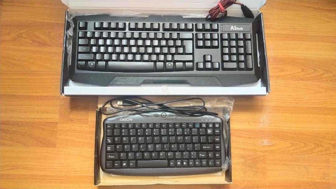 A1 tech and Okion keyboards with boxes on Carousell