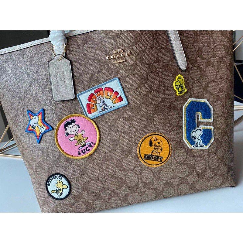 Coach x Peanuts Snoopy City Tote Bag in Signature Canvas with Varsity ...