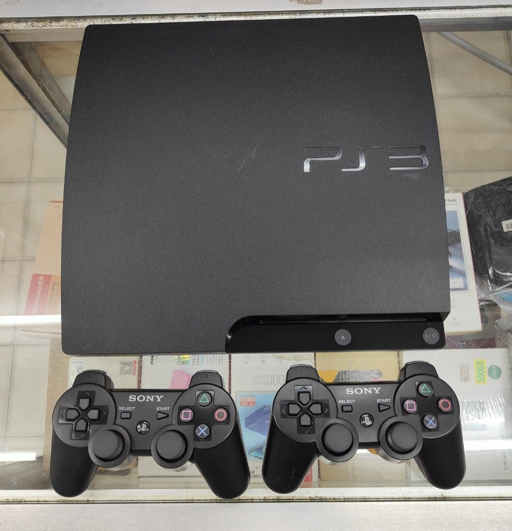 Sony PS3 Slim Console + 2 Original Controllers + 10 Games ( Provide 1 ...