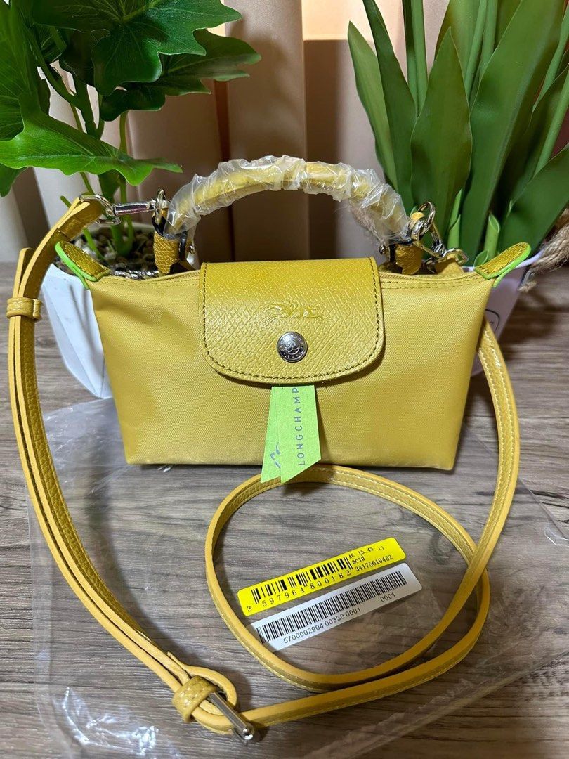 Original longchamp mini with strap on Carousell